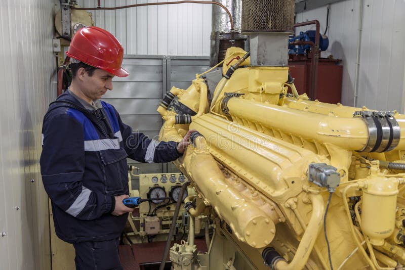 Electromechanic Performs Repair Work on a Diesel Generator Stock Image ...