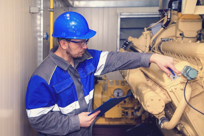 Electromechanic Performs Repair Work on a Diesel Generator Stock Photo ...