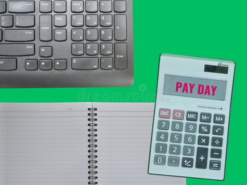 An Electronic Calculator with a Black Keyboard Displays the Words "Pay ...