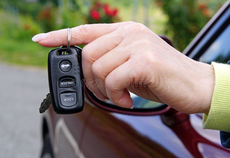 Electronic Car Key Remote in Female Hand Stock Image - Image of open ...