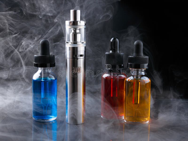Electronic Cigarette and Vape Liquids within Vapor on Black Background ...