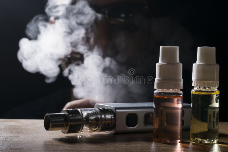 Electronic Cigarette Vaping Device With E Liquid Background Stock Image Image Of Clearomizer