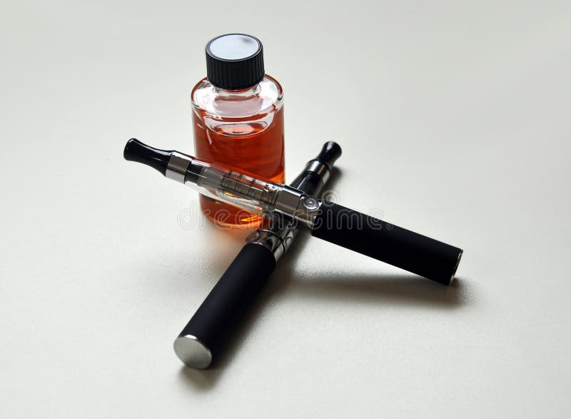 Electronic Cigarettes and E-Liquid Stock Image - Image of vaporiser ...