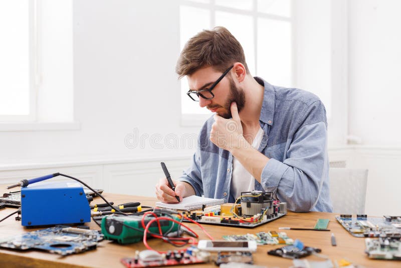 Electronic Circuit Board Inspecting in Repair Shop Stock Photo - Image ...