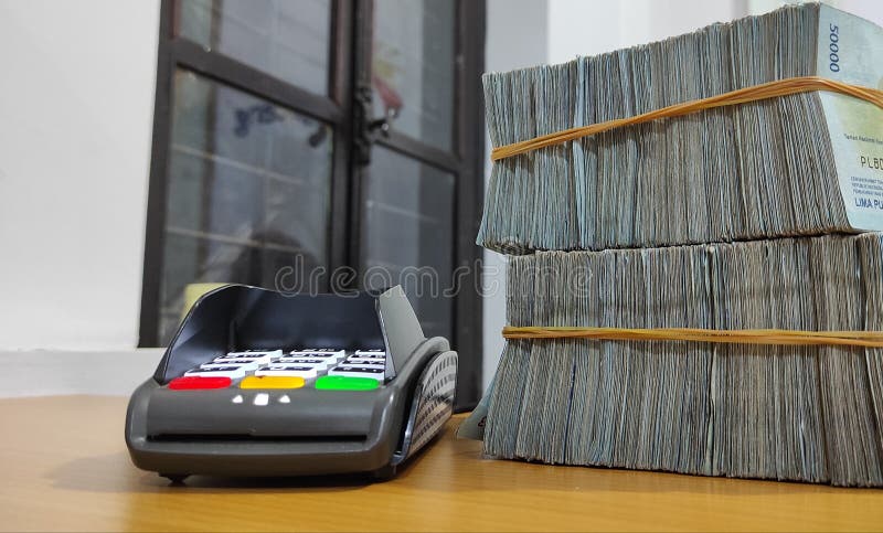 The Electronic Data Capture Machine is Next To the Pile of Money Stock ...
