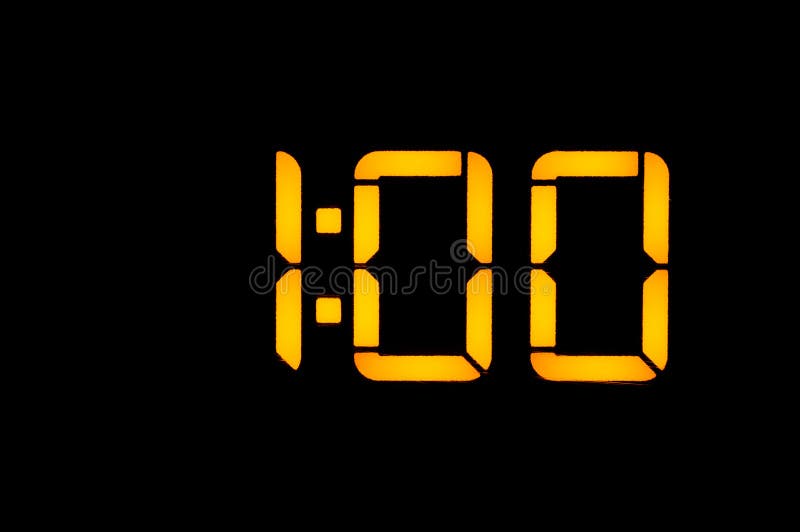 Electronic Digital Clock with Yellow Numbers on a Black Background ...