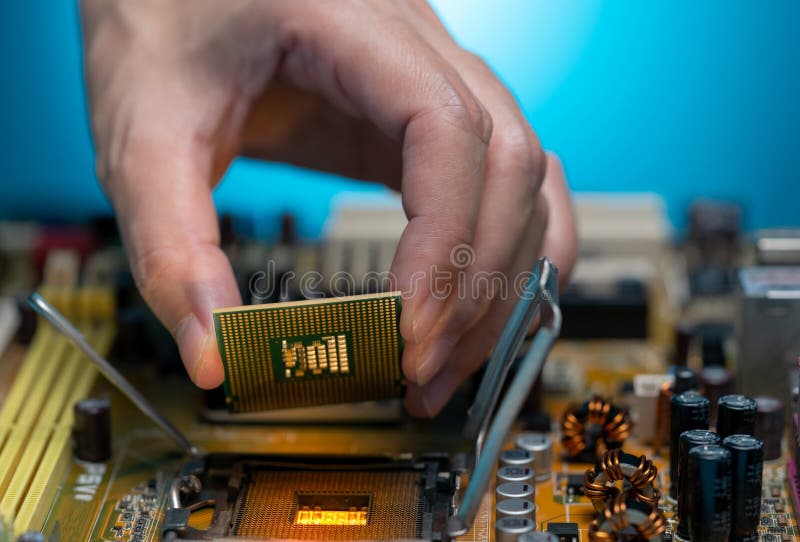 Electronic Engineer Hand Putting Computer Chip on Socket. Chipset on ...