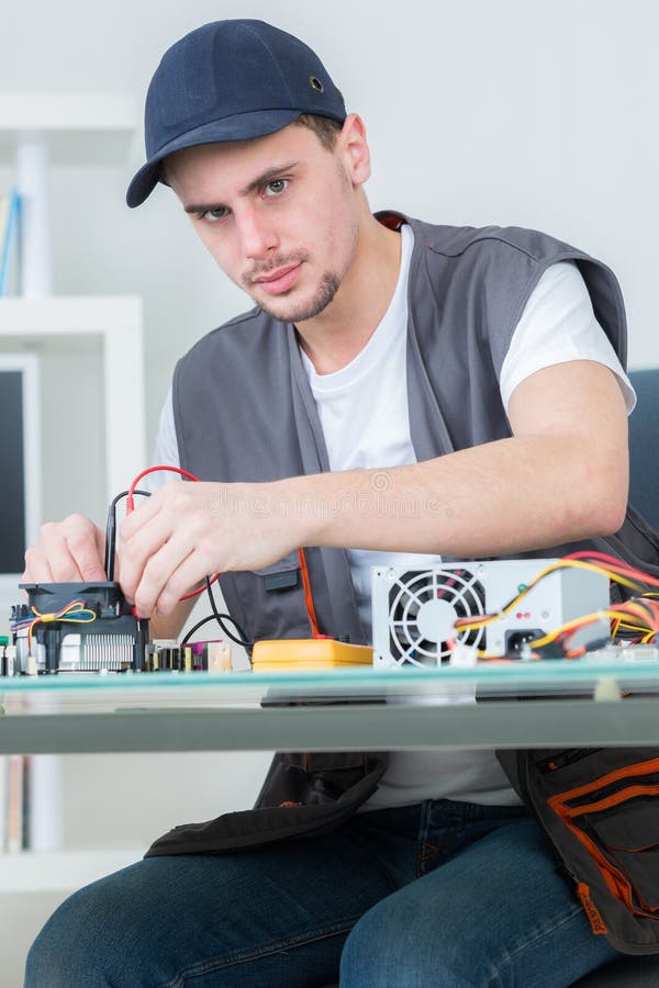 Electronic Engineer Repairing Electronic Devices on Broken Computer ...