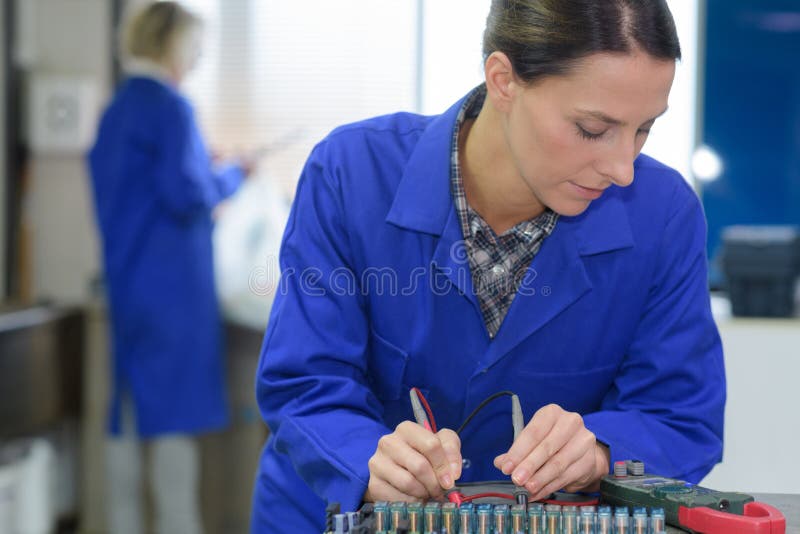 Engineers Testing the Aerodynamic Properties of a Car in a Laboratory ...