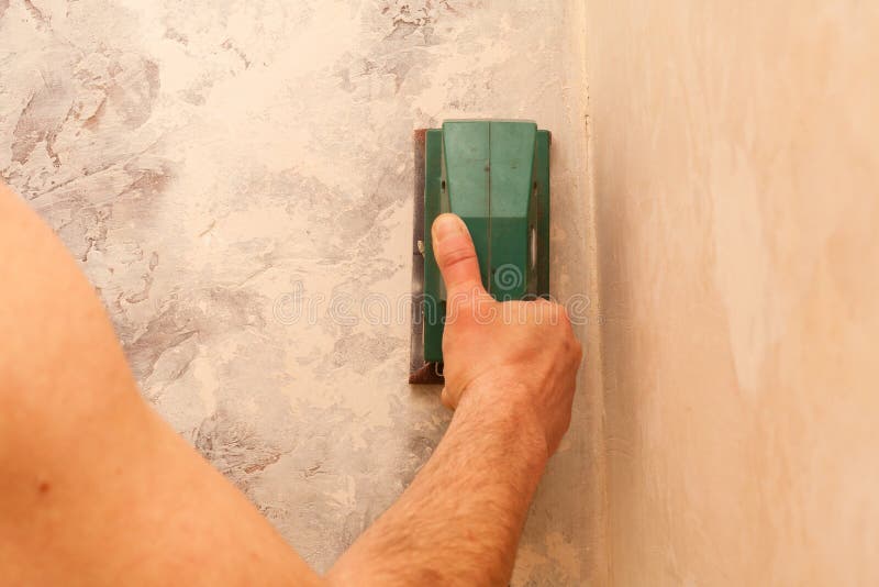 Electronic Grinder in a Hand. Grinding and Leveling the Surface of the ...