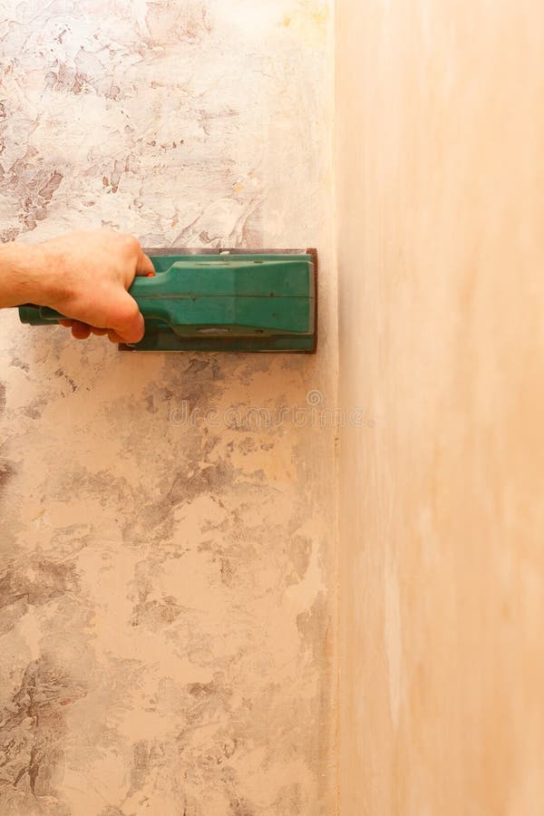 Electronic Grinder in a Hand. Grinding and Leveling the Surface of the ...
