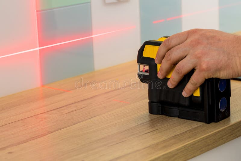 Electronic Laser Pointing Straight Lines. Checking Angles and Setting ...
