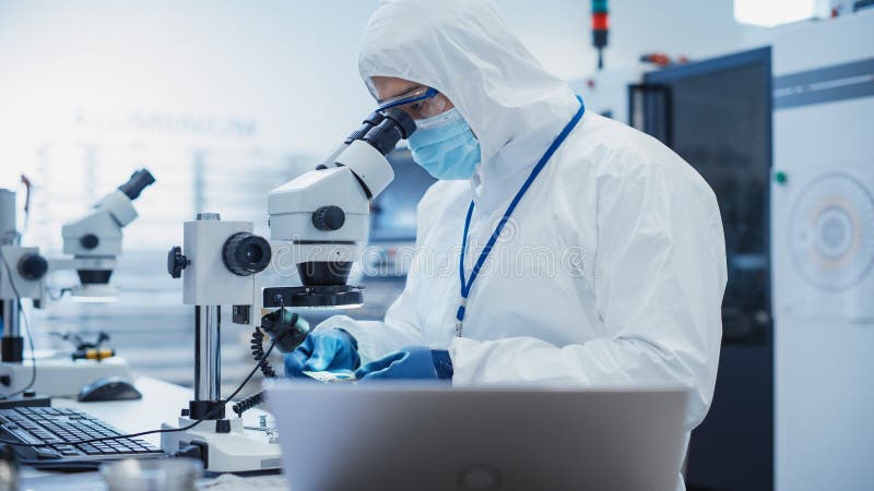 Electronic Manufacturing Factory: Engineer in Sterile Coverall ...