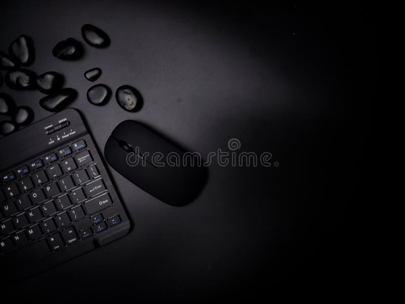 An Electronic Mouse and Keyboard Next To Some Other Things on a Table ...