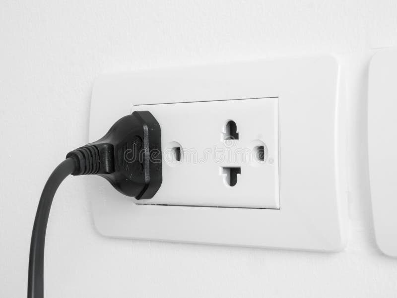 Electronic Power Plug Plugged in a Wall Socket Stock Photo - Image of ...