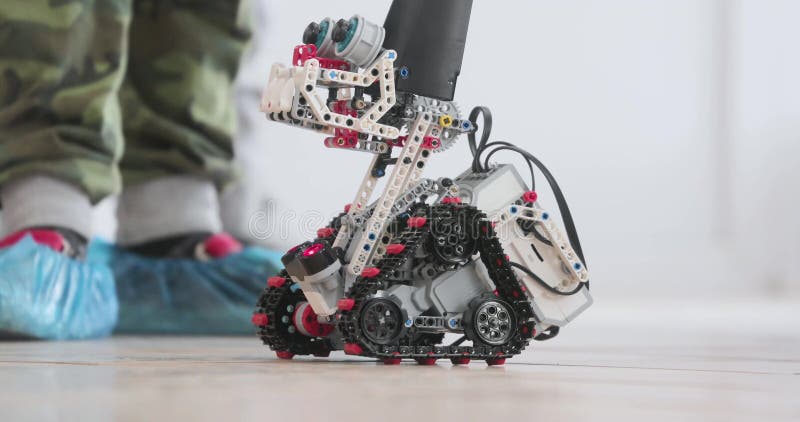 An Electronic Robot Doing Pedicure Rides among Male Legs. Stock Footage ...