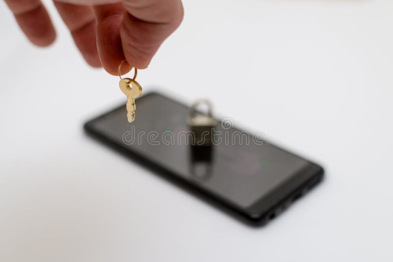 Electronic Security and Data Protection Concept. Mobile Phone and Key ...