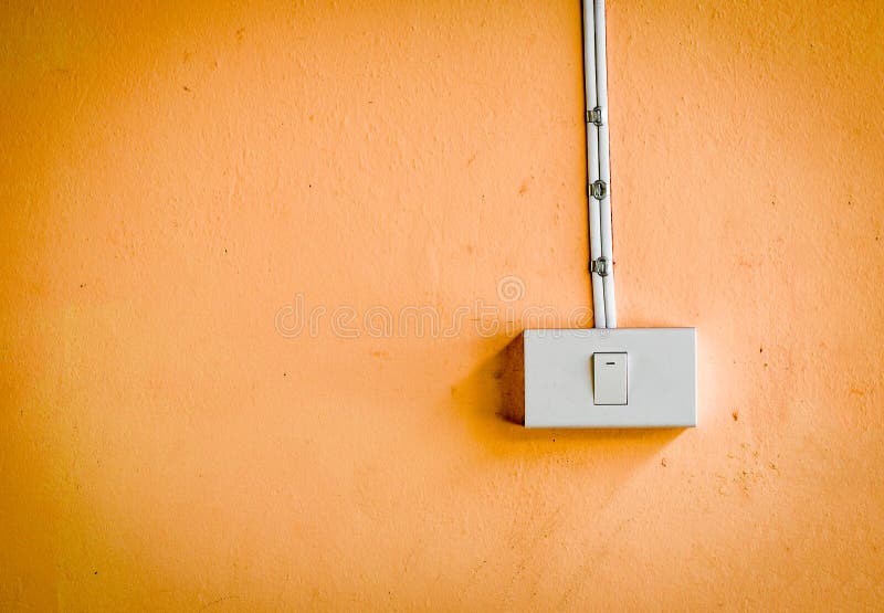 Electronic Switch on Orange Color Wall Stock Photo - Image of shot ...