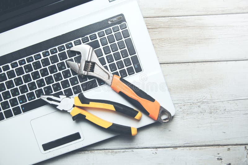 Electronic Technical Support Concept. Spanners on Computer Keyboard ...