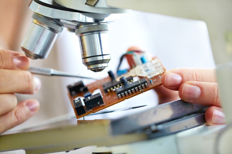Electronic technician stock photo. Image of board, hand - 77304016