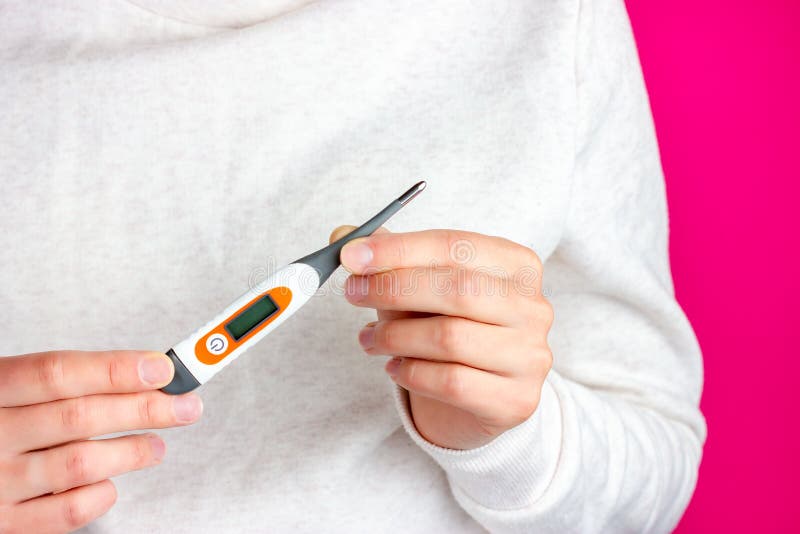Electronic Thermometer in Hands. Temperature Measurement with a ...