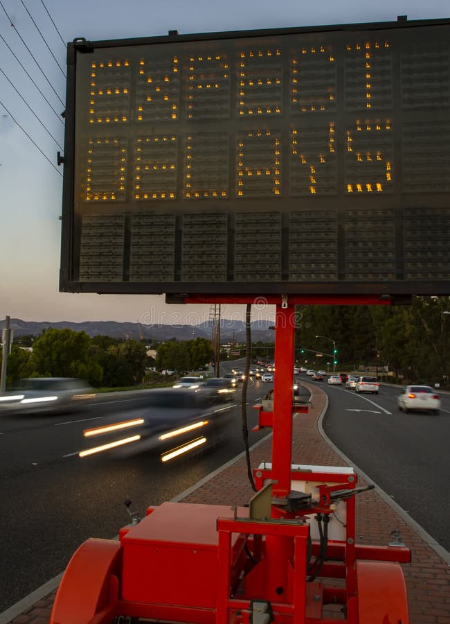 Electronic Traffic Sign Stating Use Alternate Routes with Blurred ...