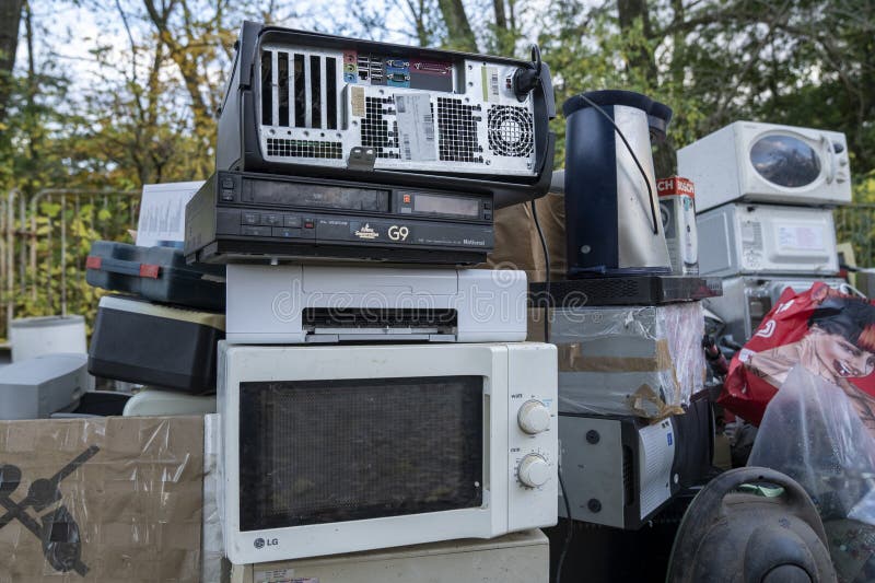 Electronic Waste Awaiting Recycling. a Pile of Garbage in Nature. Green ...