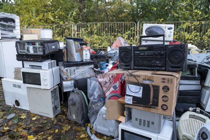 Electronic Waste Awaiting Recycling. a Pile of Garbage in Nature. Green ...