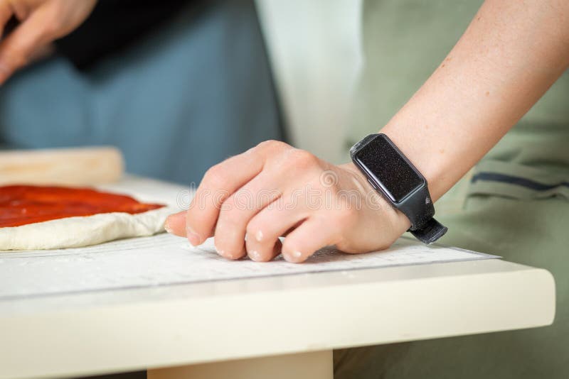 Electronic Watch on the Hand of a Cook Doing Cooking in the Kitchen ...