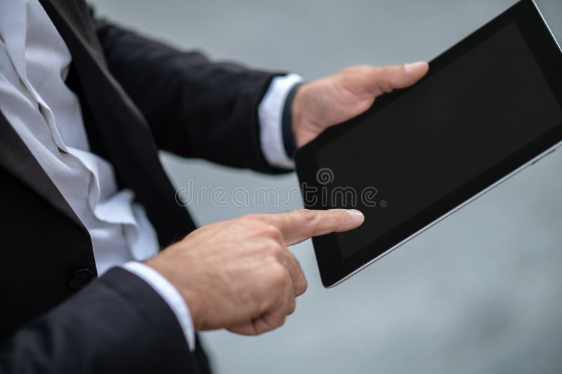 Close Up of a Mans Hand Touching the Sensor Screen of a Tablet Stock ...