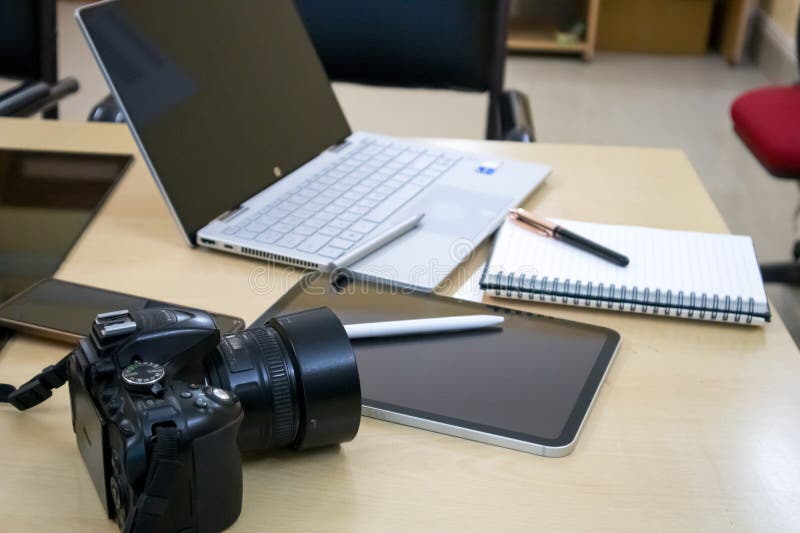 Electronics Items on a Table, Tablet, Laptop, Pencil, Pen, Mobile and a ...