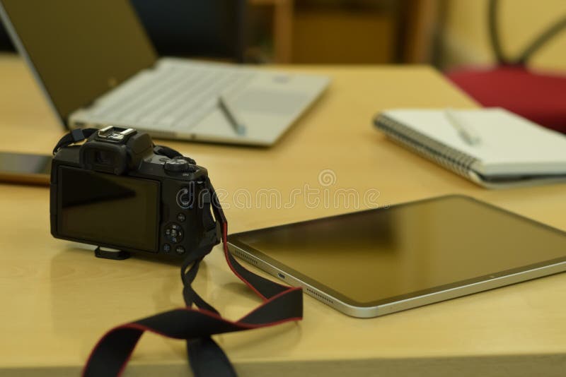 Electronics Items on a Table, Tablet, Laptop, Pencil, Pen, Mobile and a ...