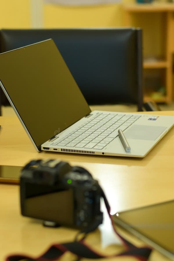 Electronics Items on a Table, Tablet, Laptop, Pencil, Pen, Mobile and a ...