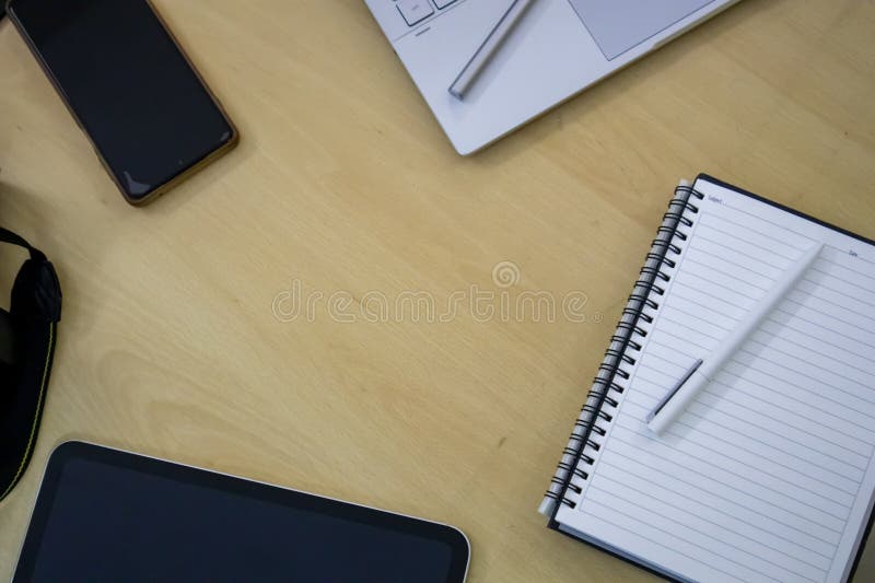 Electronics Items on a Table, Tablet, Laptop, Pencil, Pen and a Note ...