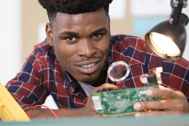 Electronics Repair Master Using Magnifying Glass Stock Image - Image of ...