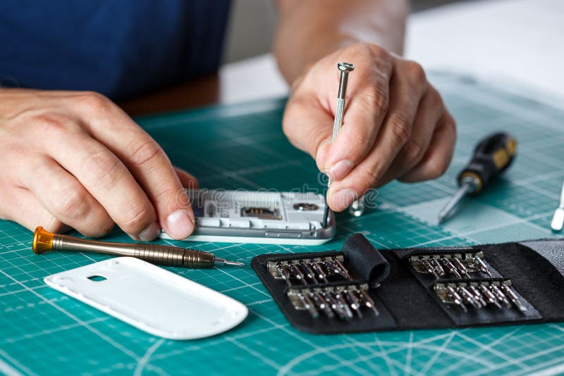 Electronics Repair Service. Technician Disassembling Smartphone for ...