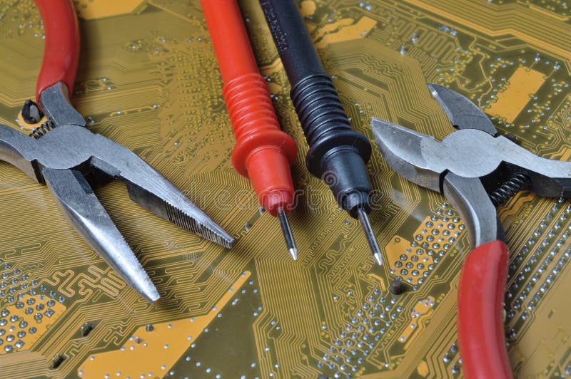 The Electronics Repair Tool Lies on the Motherboard from the Computer ...