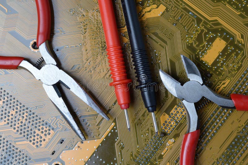 The Electronics Repair Tool Lies on the Motherboard from the Computer ...