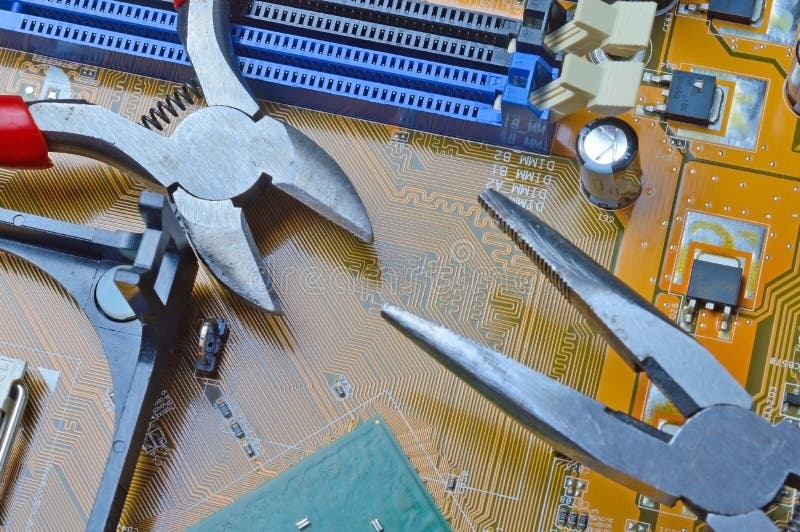 The Electronics Repair Tool Lies on the Motherboard from the Computer ...