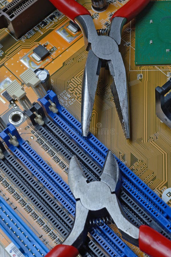 The Electronics Repair Tool Lies on the Motherboard from the Computer ...