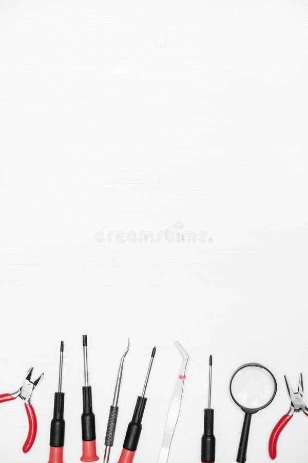 Electronics Repair Tools are Lined in a Row in the Center White ...
