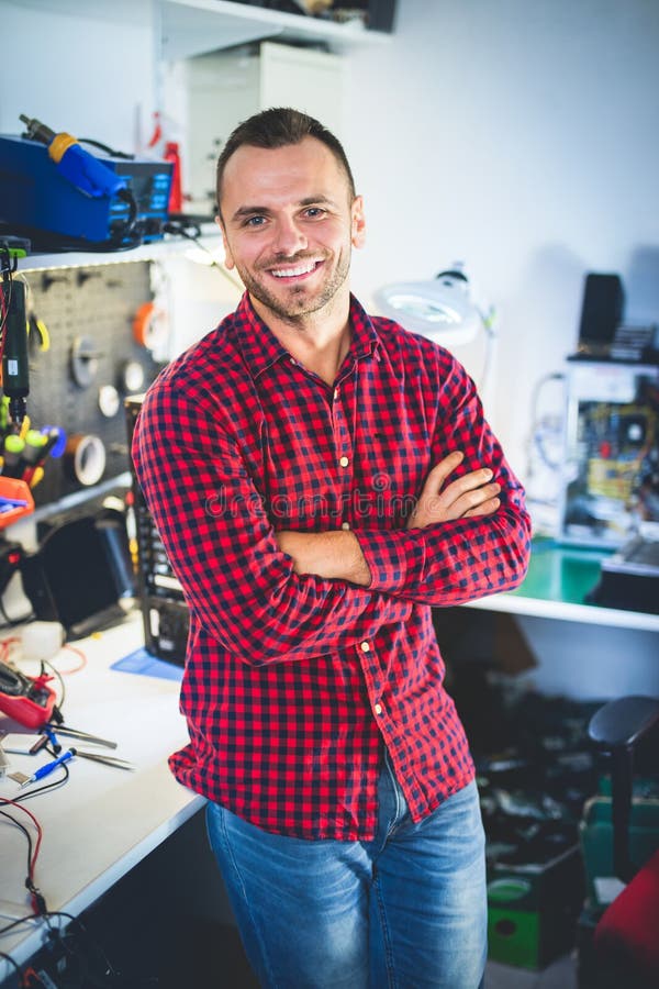 Electronics Service Shop Owner at Work Repairing Computer Stock Photo ...