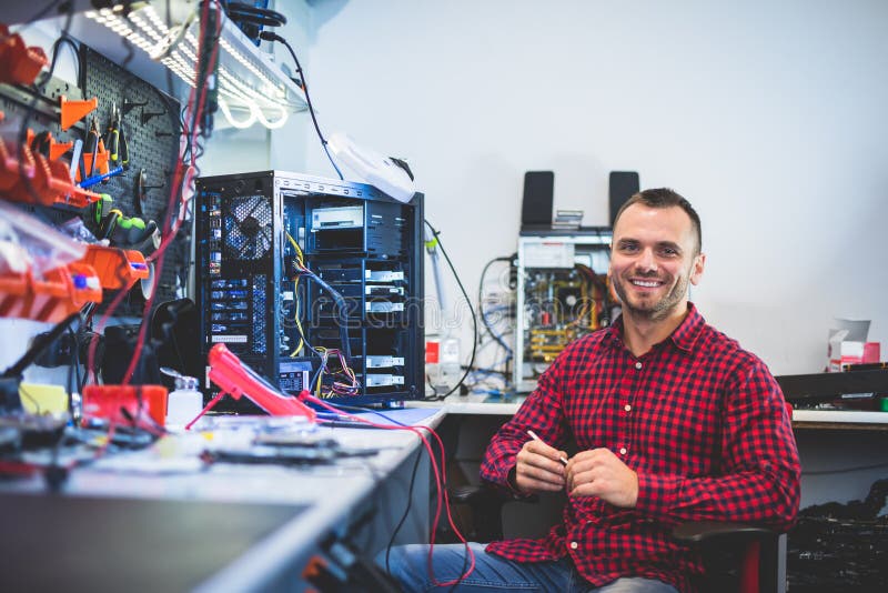 Electronics Service Shop Owner at Work Repairing Computer Stock Photo ...