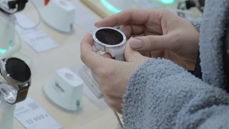 Electronics Store, Girl Looks at Smart Watch, Modern Technology Stock ...
