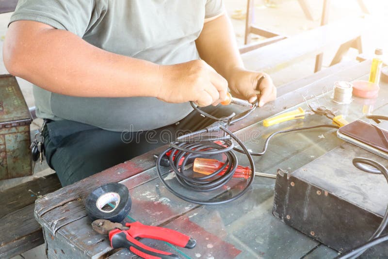 Electronics Technician Men are Repairing Electrical Appliances ...