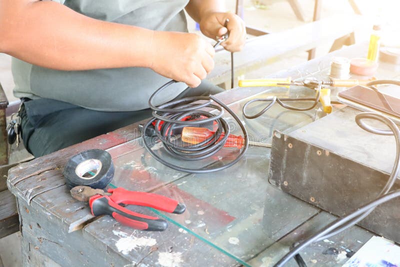 Electronics Technician Men are Repairing Electrical Appliances ...
