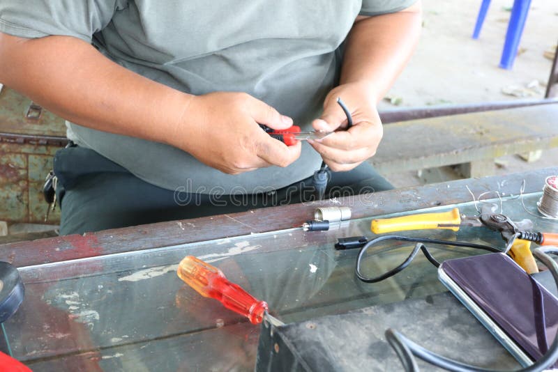 Electronics Technician Men are Repairing Electrical Appliances ...