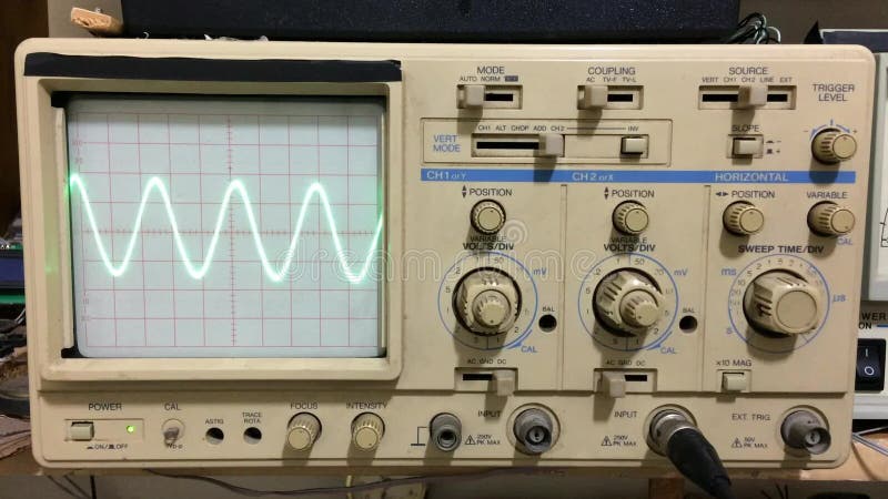 Electronics Working with Oscilloscope and Sine Wave Shown on ...