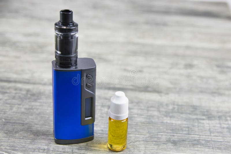 E - Cigarette for Vaping , Technical Devices.the Liquid in the Bottle ...