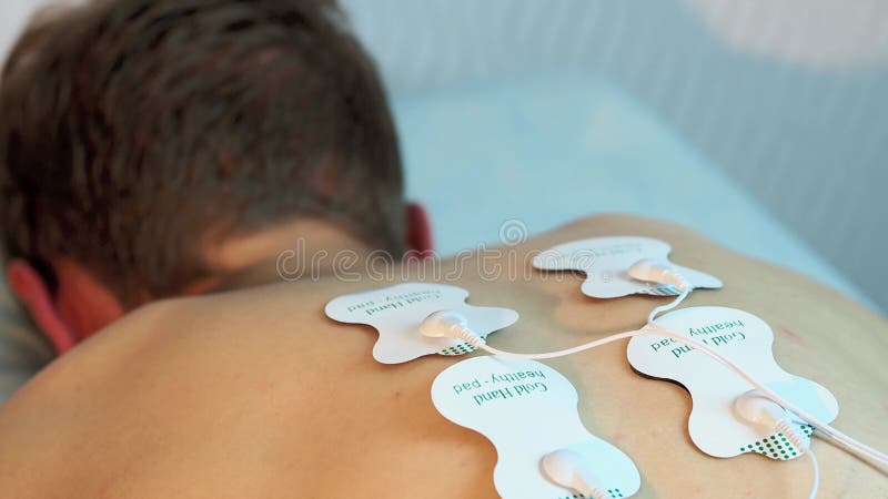 Electrotherapy. Physiotherapy Procedure, Myostimulation of the Back ...